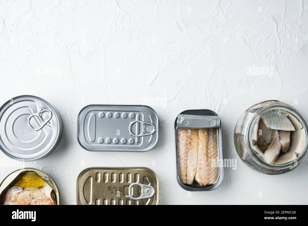 Assortment of cans of canned with different types of fish set, on white ...