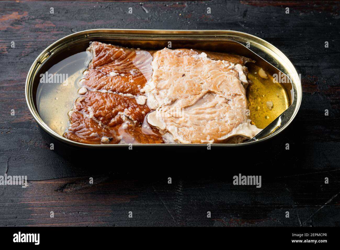 Wild Alaska Salmon Canned smoked fish set, in tin can, on old dark ...