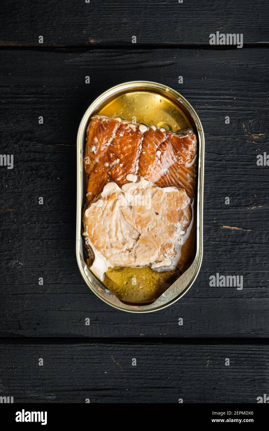 Wild Alaska Salmon Canned smoked fish set, in tin can, on black wooden ...