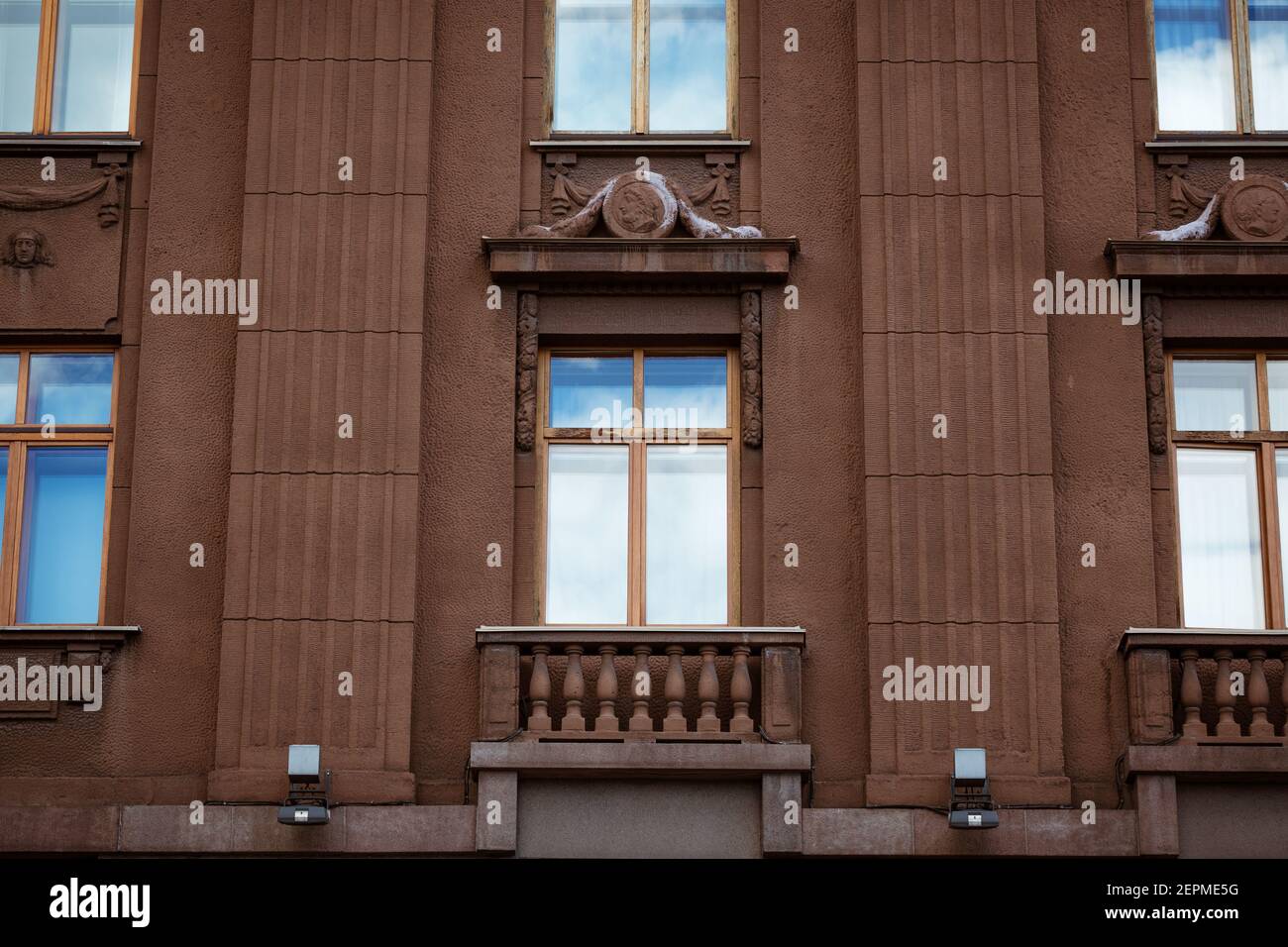 the facade of the building with windows and balusters, the sky is ...