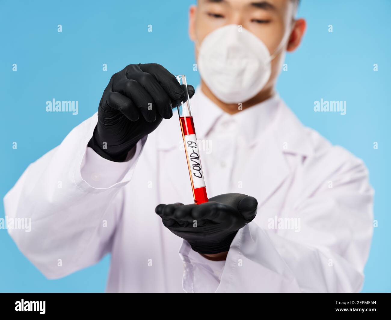 Man of Asian appearance Laboratory blood test examination Stock Photo ...