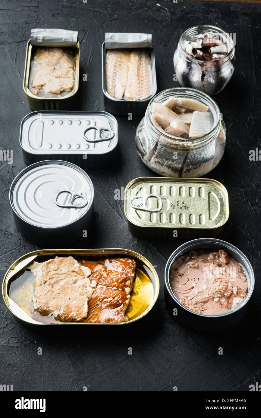 Canned fish with different assortment types of seafood set, on black ...