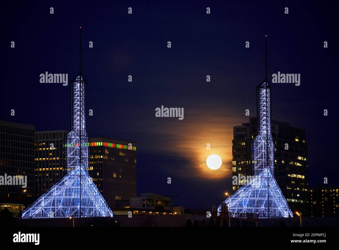 The Wolf Moon rises behind the Convention Center in Portland, Ore., on ...