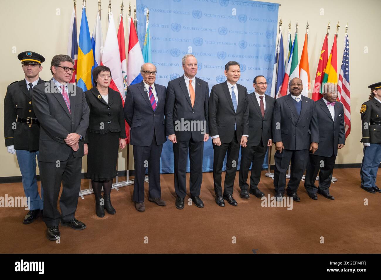 Representatives pose for a group photo following the installation of ...
