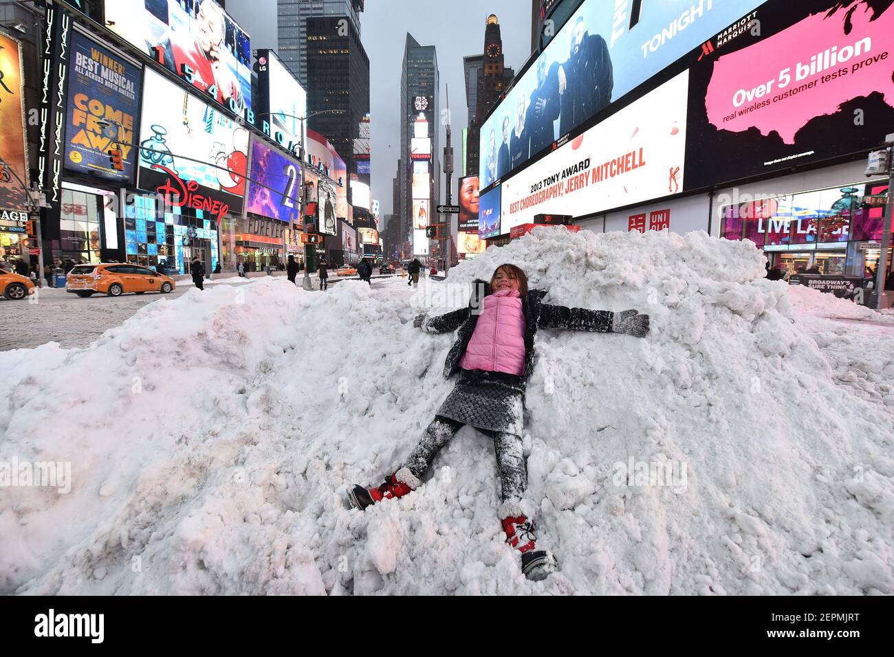 Cara Murphy, 7, visiting from Australia, makes a snow angel on a snow ...