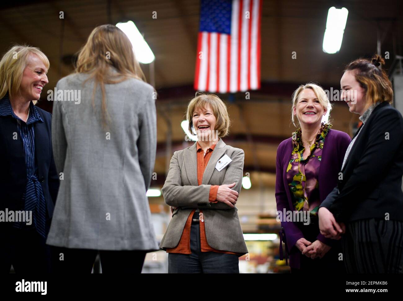 Sen. Tina Smith, middle, talks with Wyoming Machine Inc. co-presidents ...