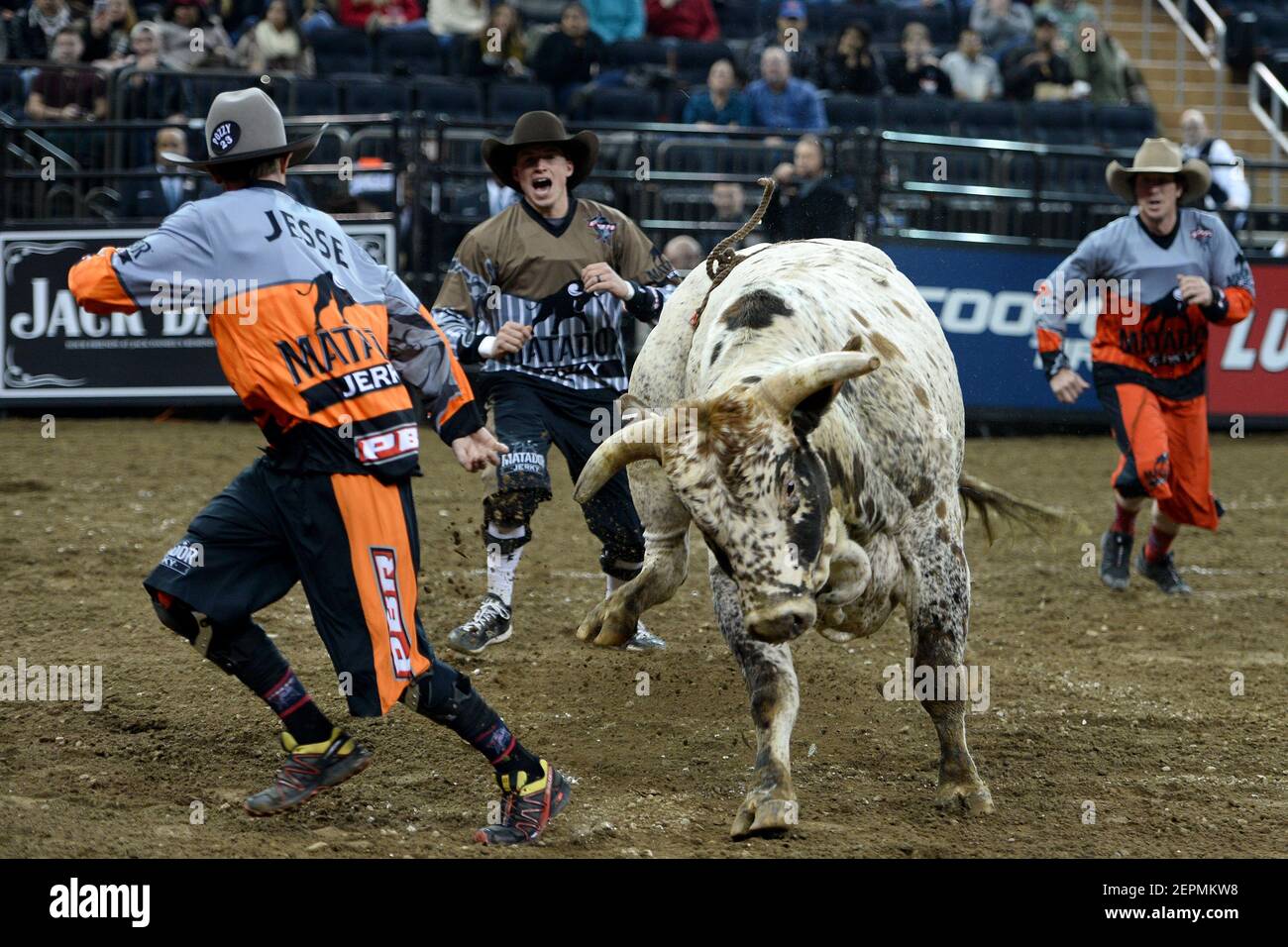 A bull named Space Plane tries to gore bull wranglers during the 1st ...