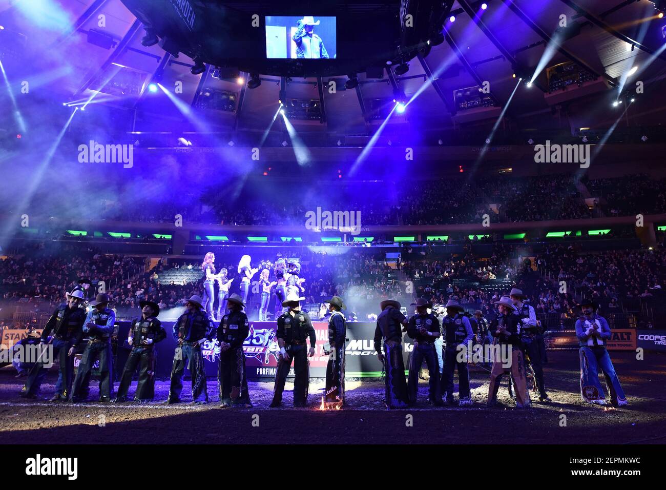 Professional Bull Riders stand together in the arena during opening ...
