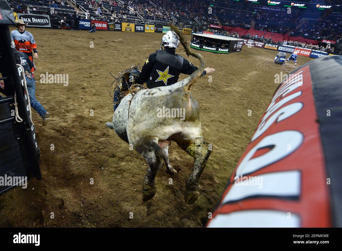 Rider Dener Barbosa leave the chute atop a bull named Spike during the ...