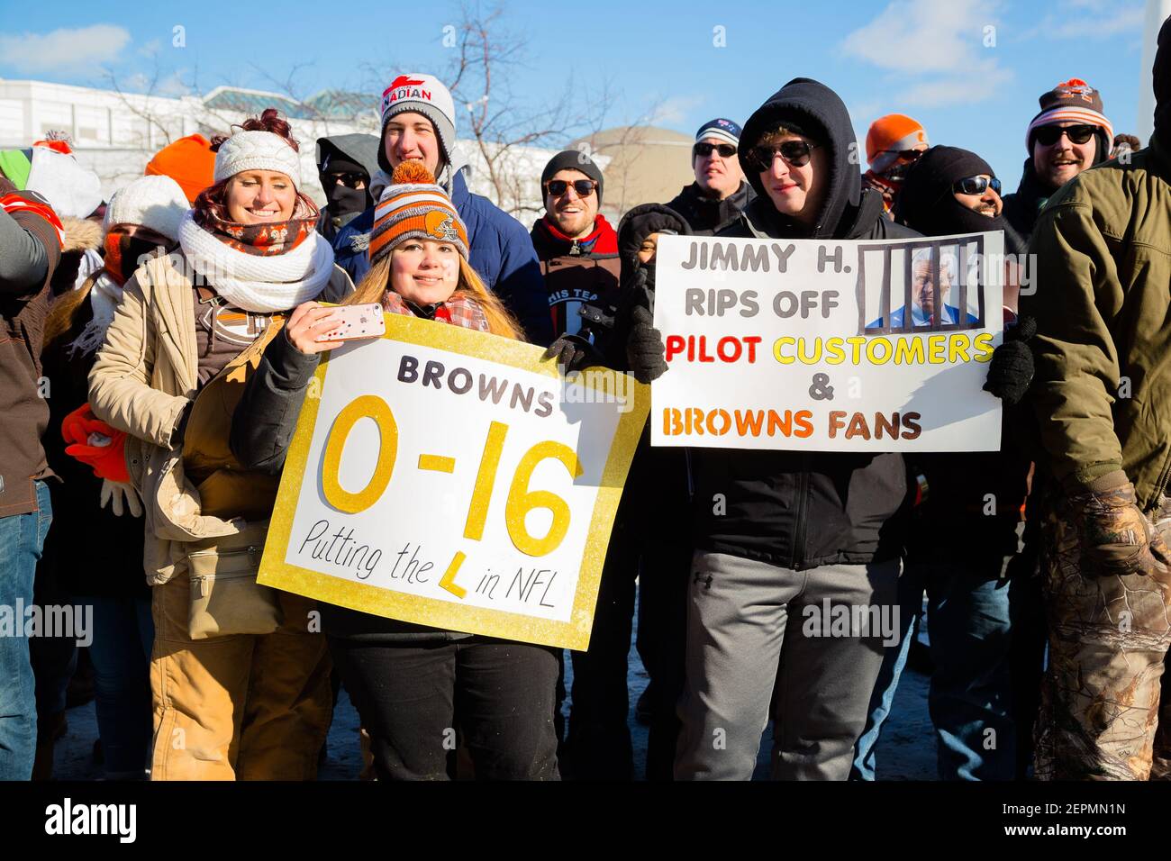 Fans hold up signs during the Cleveland Browns Perfect Season Parade ...