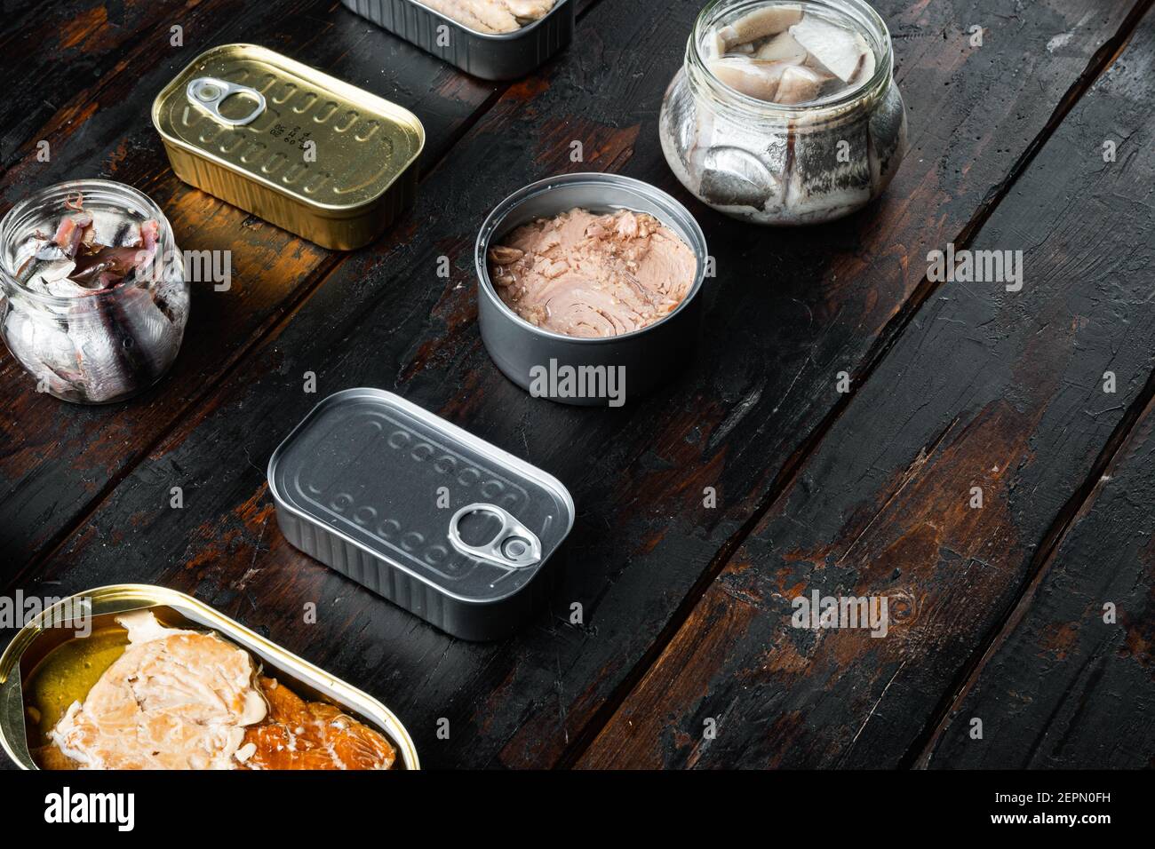 Canned fish with different assortment types of seafood set, on old dark ...
