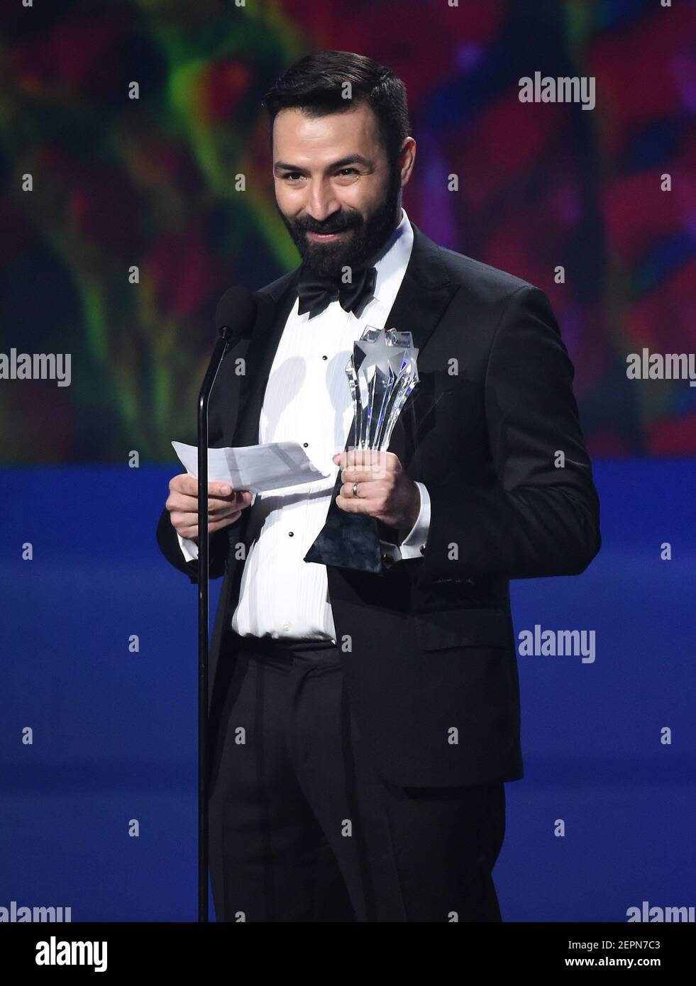 SANTA MONICA, CA - JANUARY 11: Writer/director Adrian Molina accepts ...