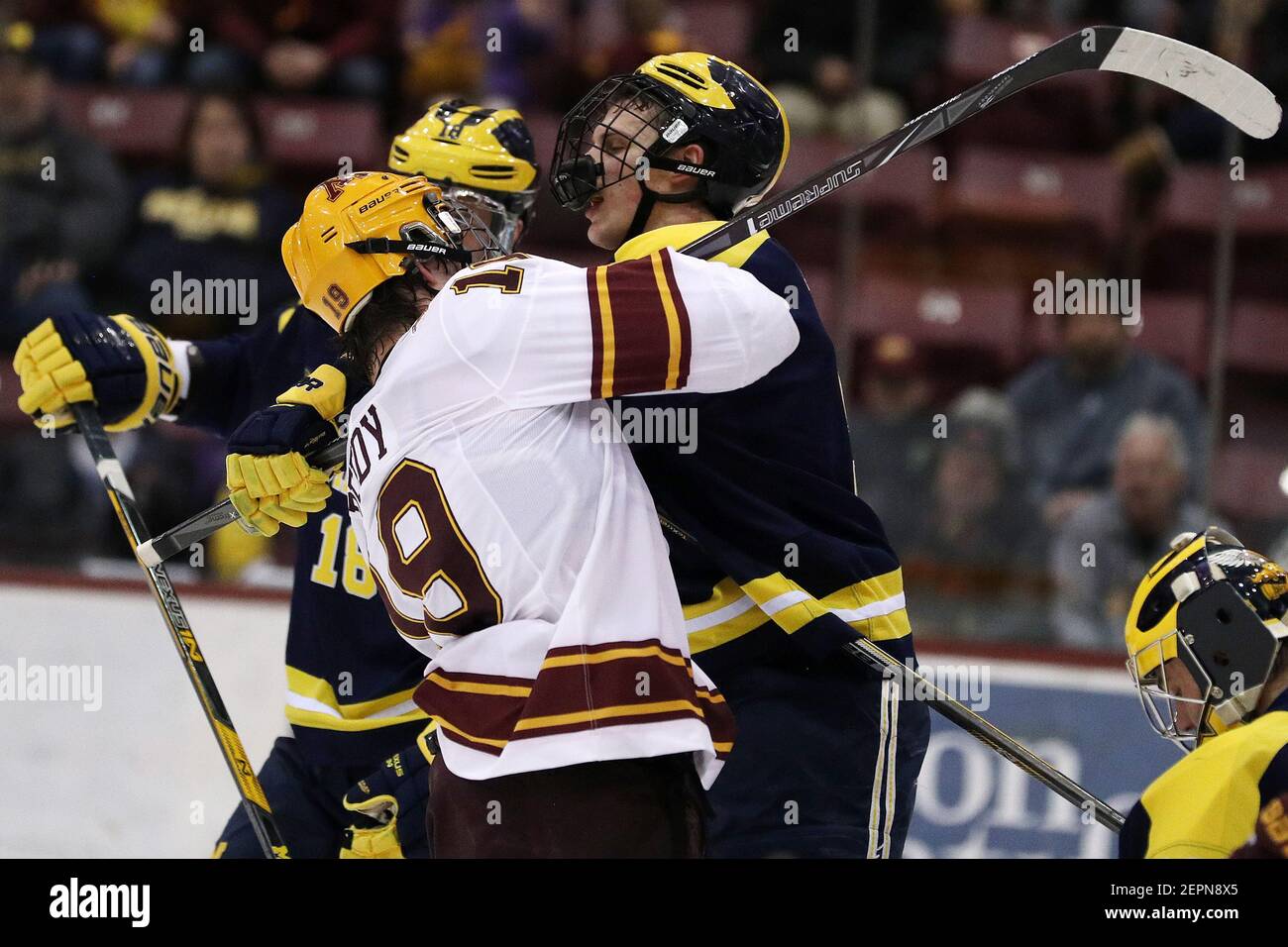 Minnesota's Scott Reedy (19) tangles with Michigan's Griffin Luce (5 ...