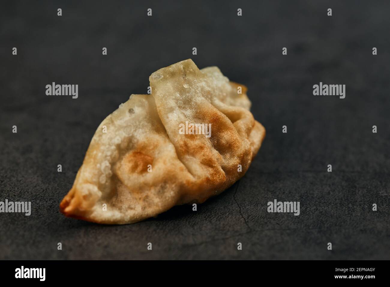 High angle of fried gyoza traditional oriental food placed on gray ...