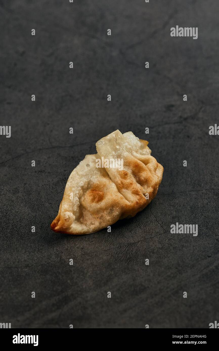 High angle of fried gyoza traditional oriental food placed on gray ...