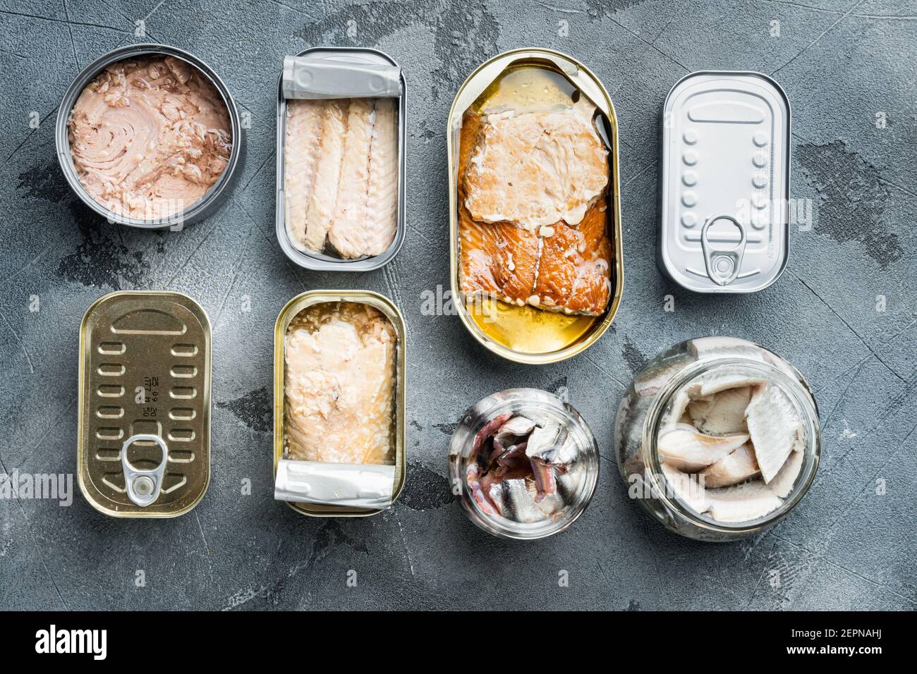 Assortment of cans of canned with different types of fish set, on gray ...