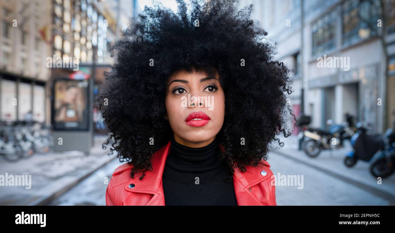Black Woman with afro hair on the street Stock Photo - Alamy