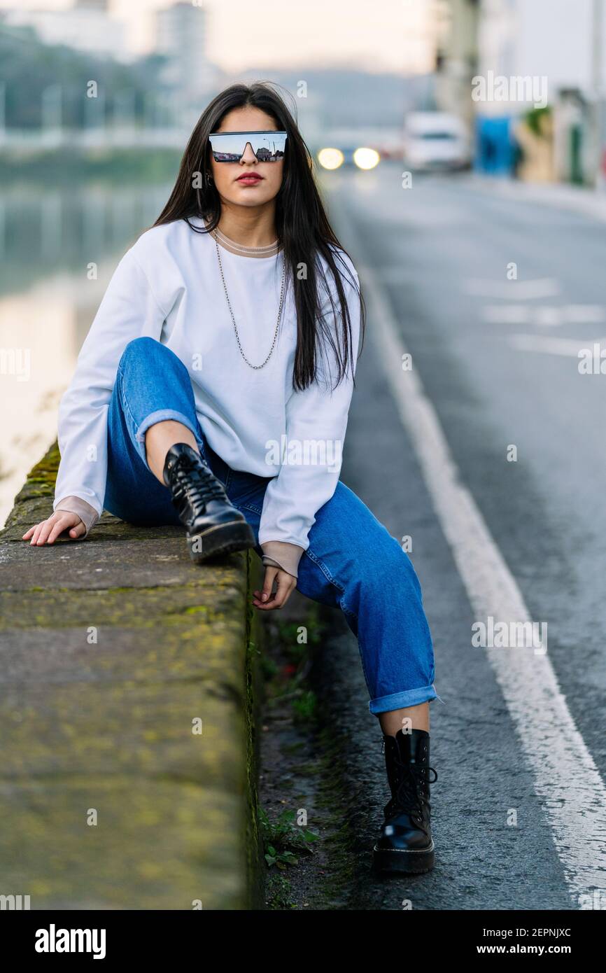 Full body side view of fit female in sportswear doing supported ...