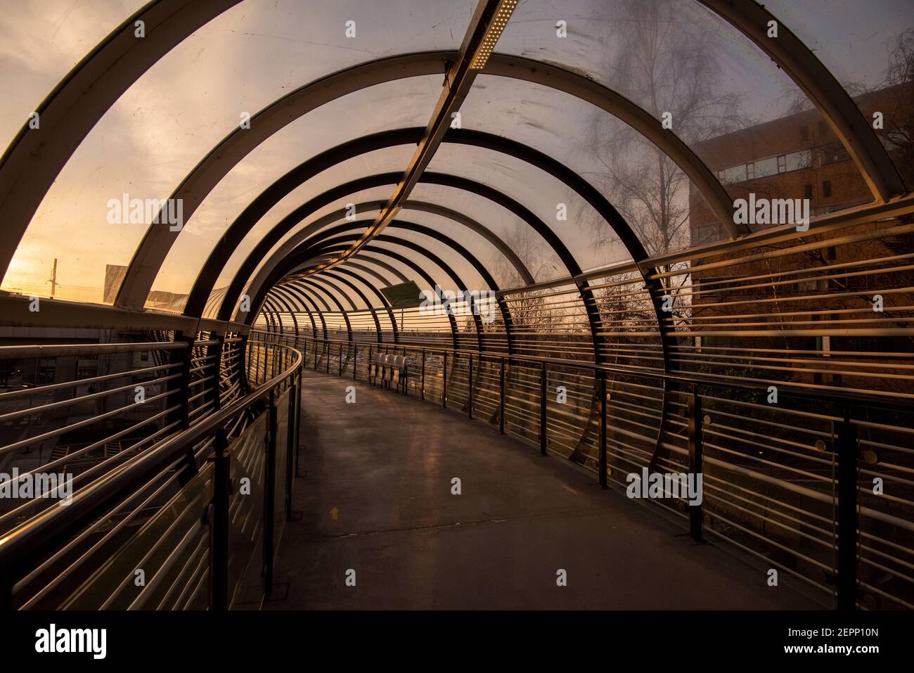 Morning light on the Sir Peter Mansfield tram bridge at the Queens ...