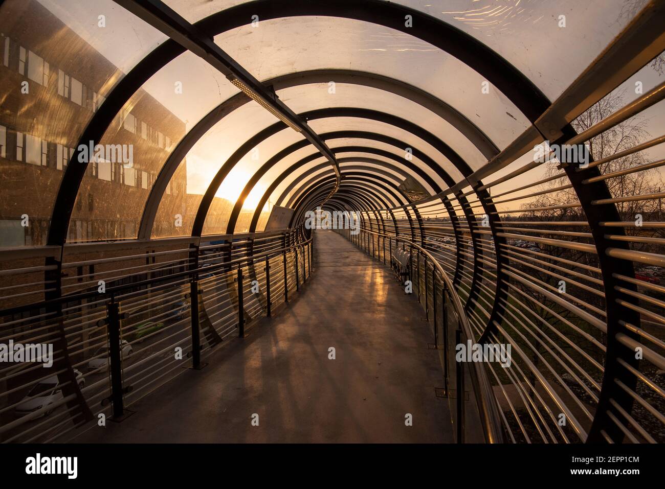 Morning light on the Sir Peter Mansfield tram bridge at the Queens ...