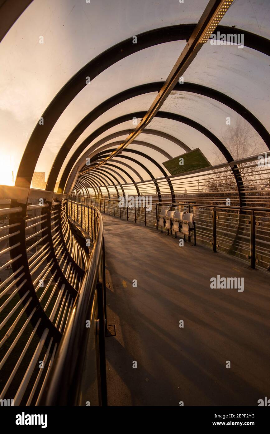 Morning light on the Sir Peter Mansfield tram bridge at the Queens ...