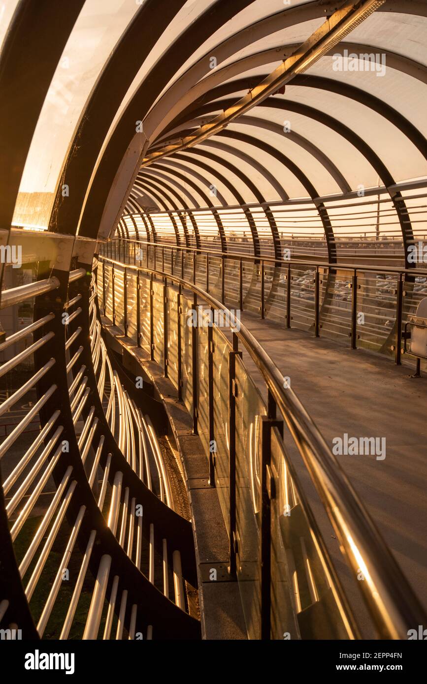 Morning light on the Sir Peter Mansfield tram bridge at the Queens ...