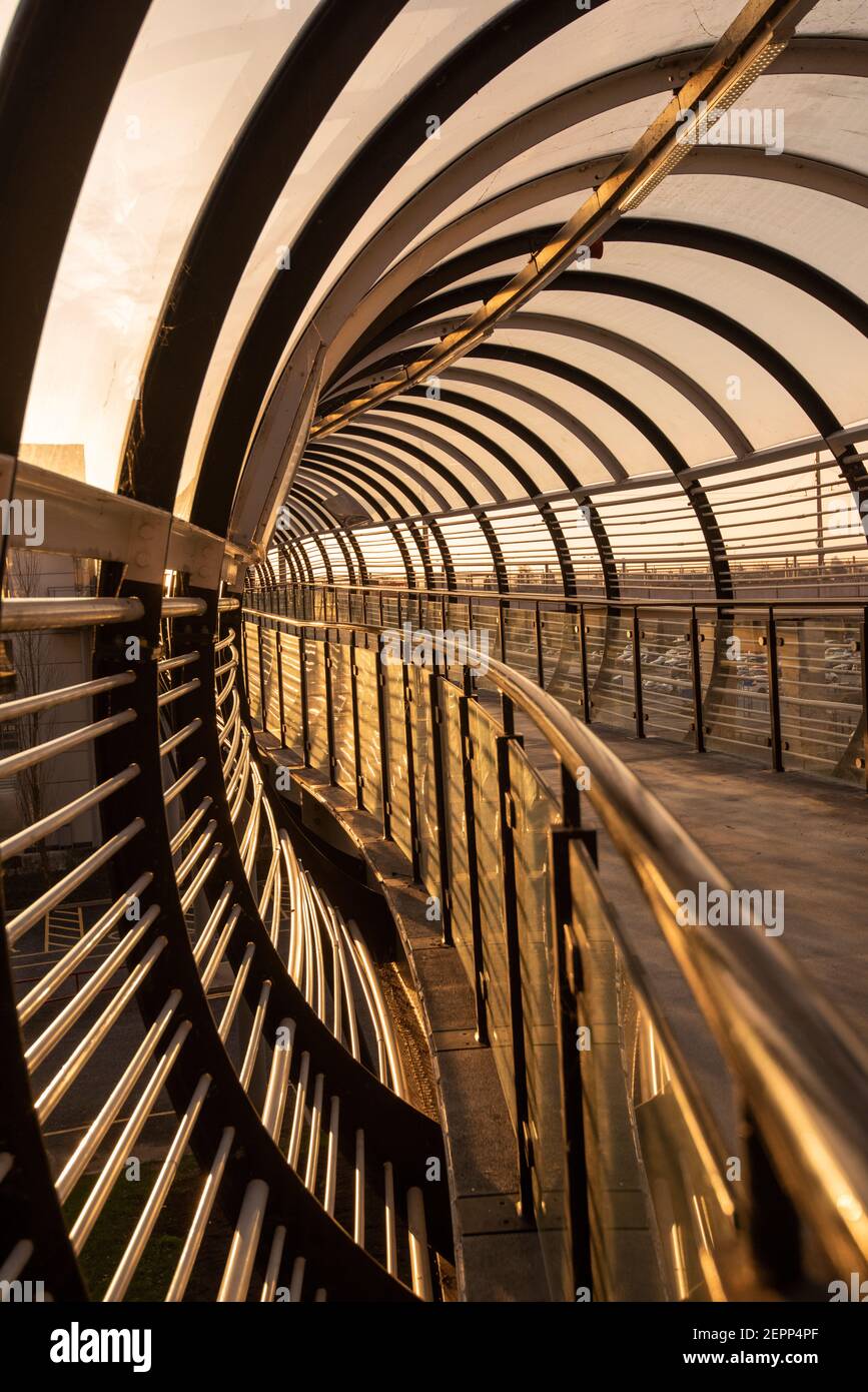 Morning light on the Sir Peter Mansfield tram bridge at the Queens ...