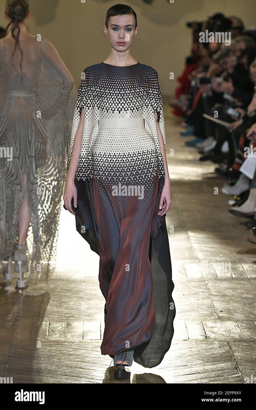 Model Meg Fairbairn walks on the runway during the Iris Van Herpen ...