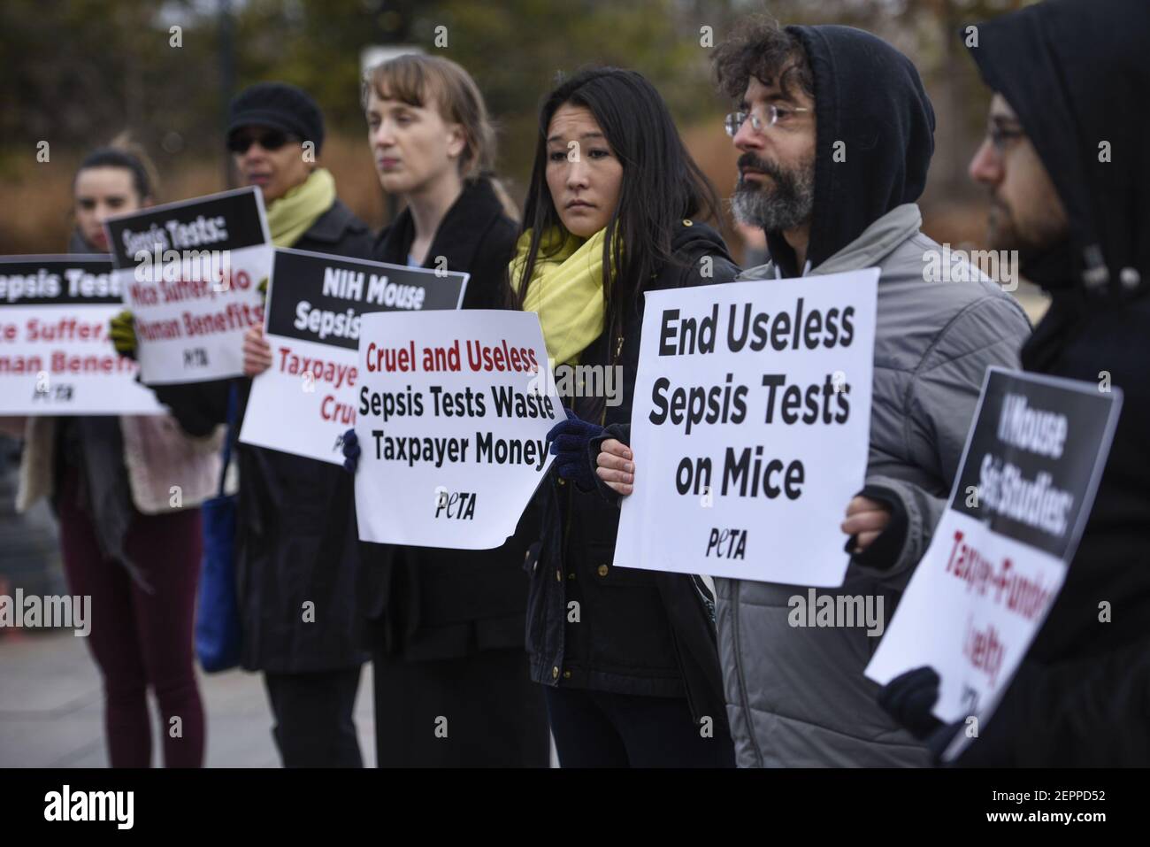 PETA animal rights demonstrators hold signs to protest sepsis ...