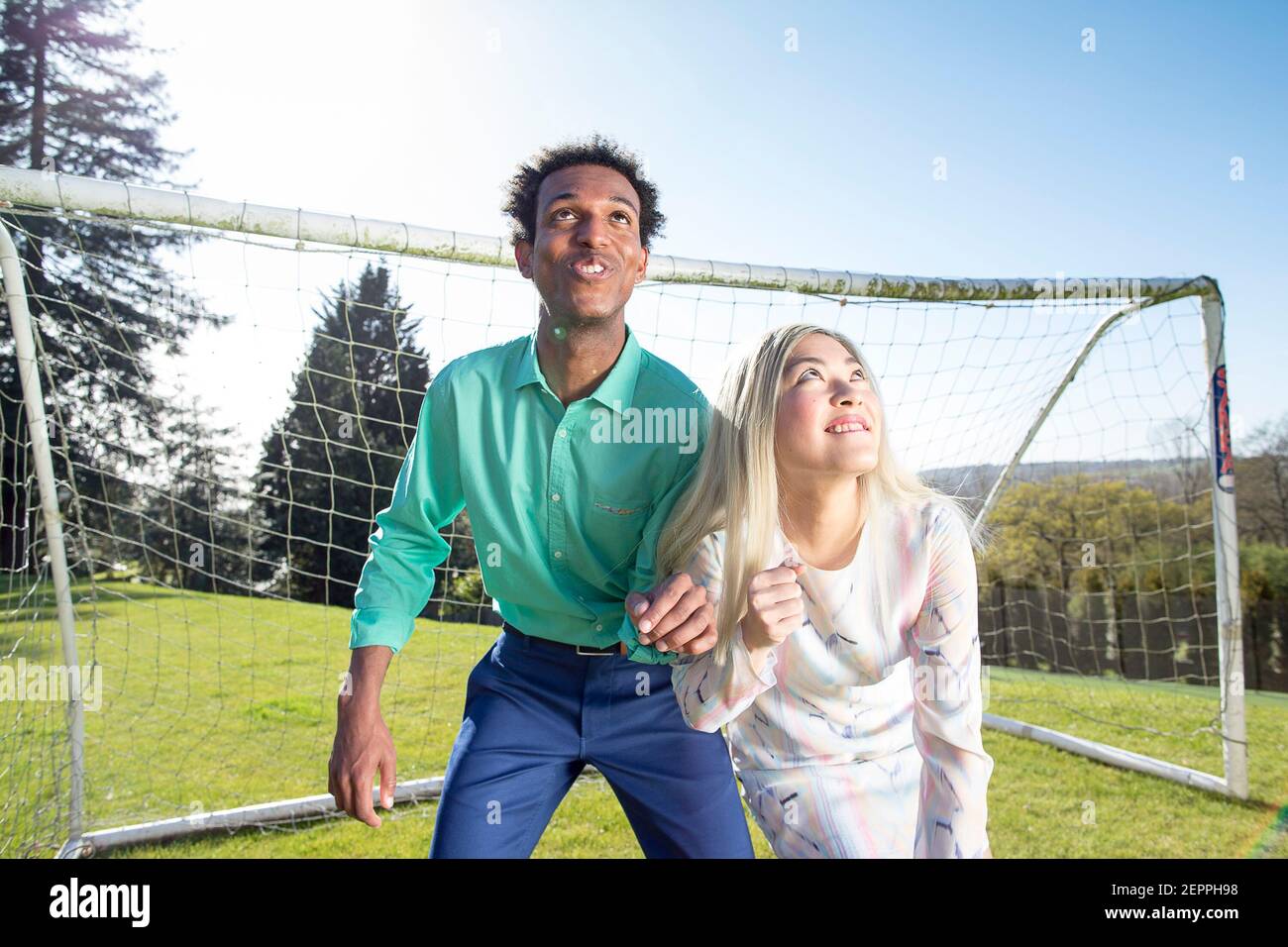 Football fashion story with a black male model and blonde Chinese ...