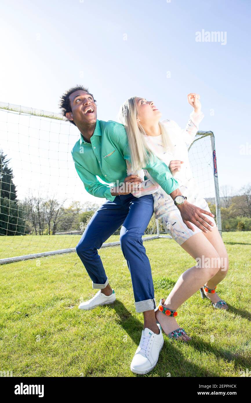 Football fashion story with a black male model and blonde Chinese ...
