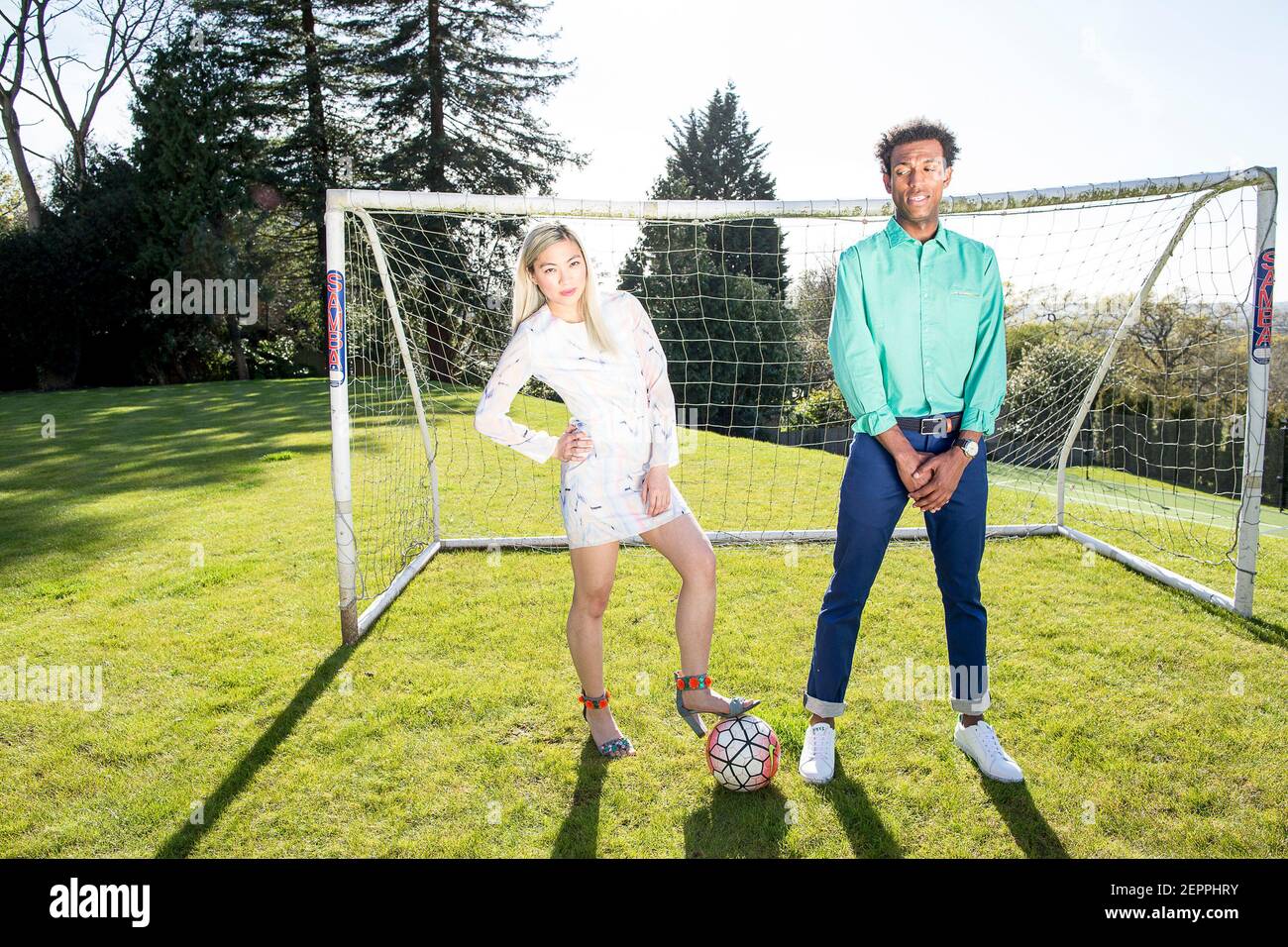 Football fashion story with a black male model and blonde Chinese ...