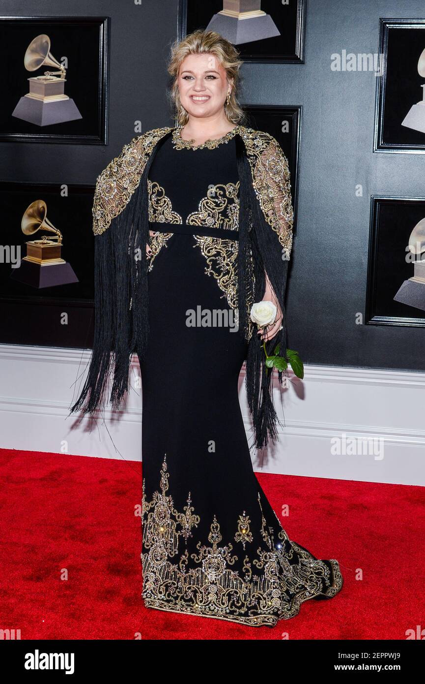 Kelly Clarkson arrives at the 60th Annual GRAMMY Awards red carpet at ...