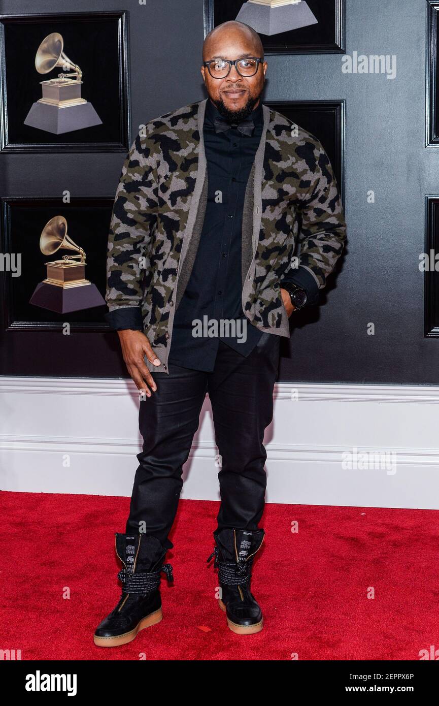Eric Dawkins arrives at the 60th Annual GRAMMY Awards red carpet at ...