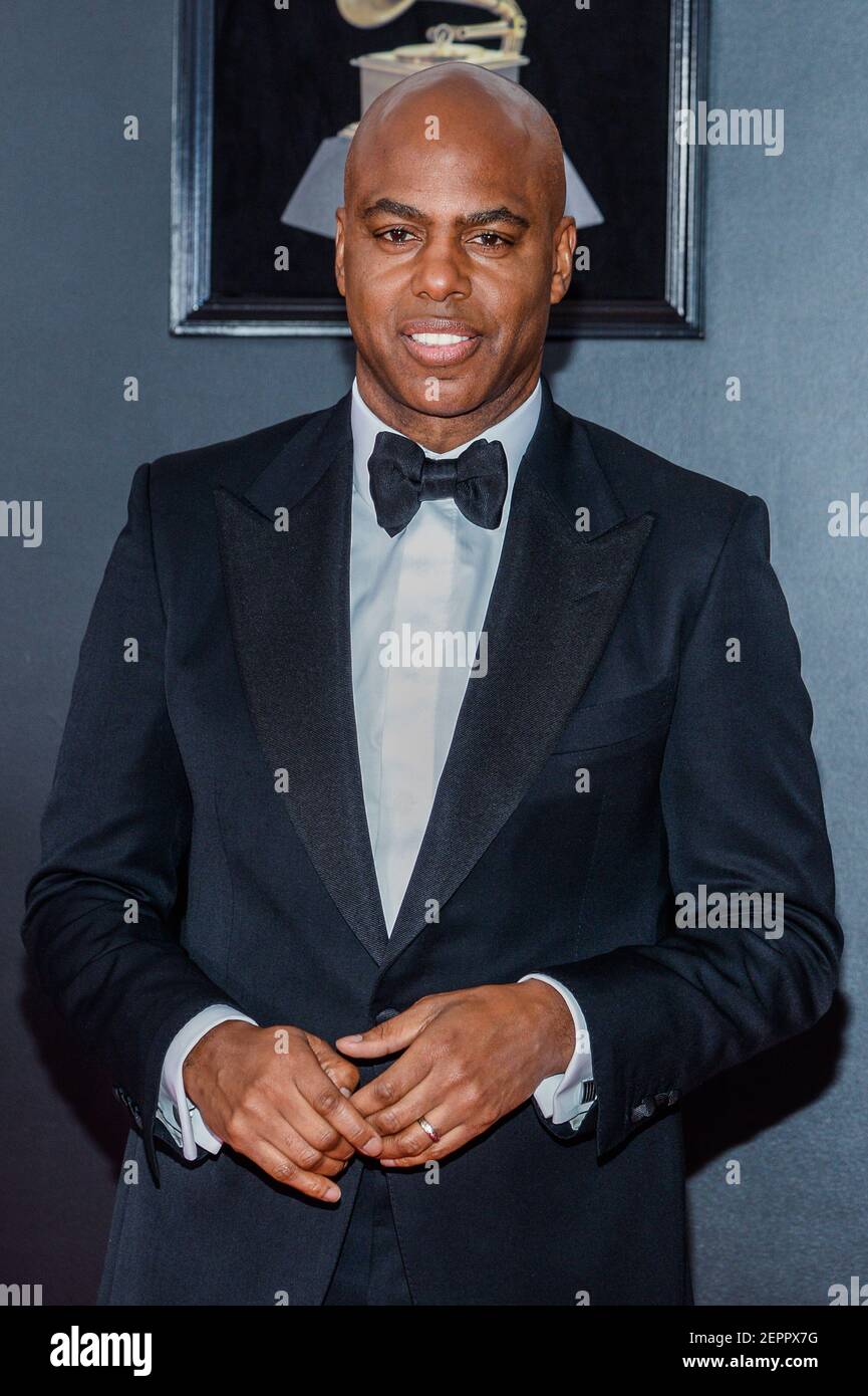 Kevin Frazier arrives at the 60th Annual GRAMMY Awards red carpet at ...