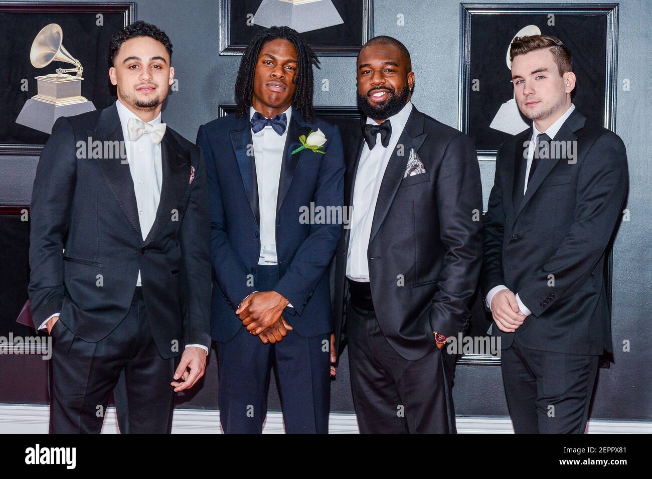 Daniel Caesar (2nd from left) arrives at the 60th Annual GRAMMY Awards ...