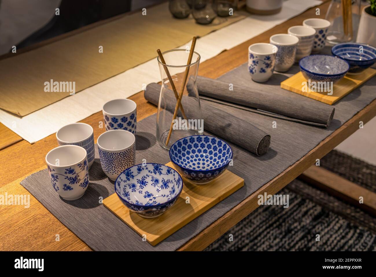 Asian table setting. Blue and withe empty bowls, cups and bamboo ...
