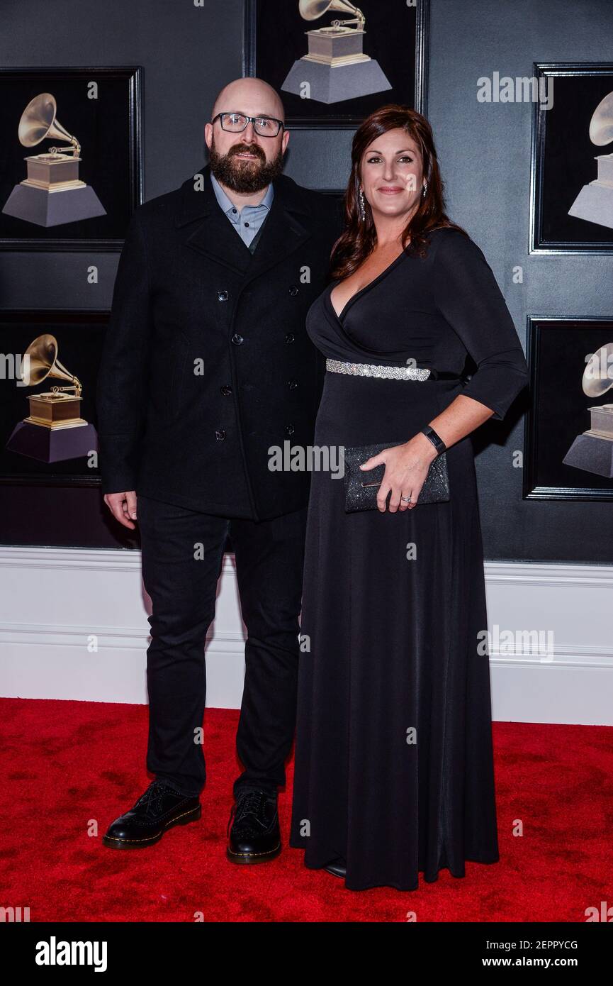 Adam Hawkins and Guest arrives at the 60th Annual GRAMMY Awards red ...