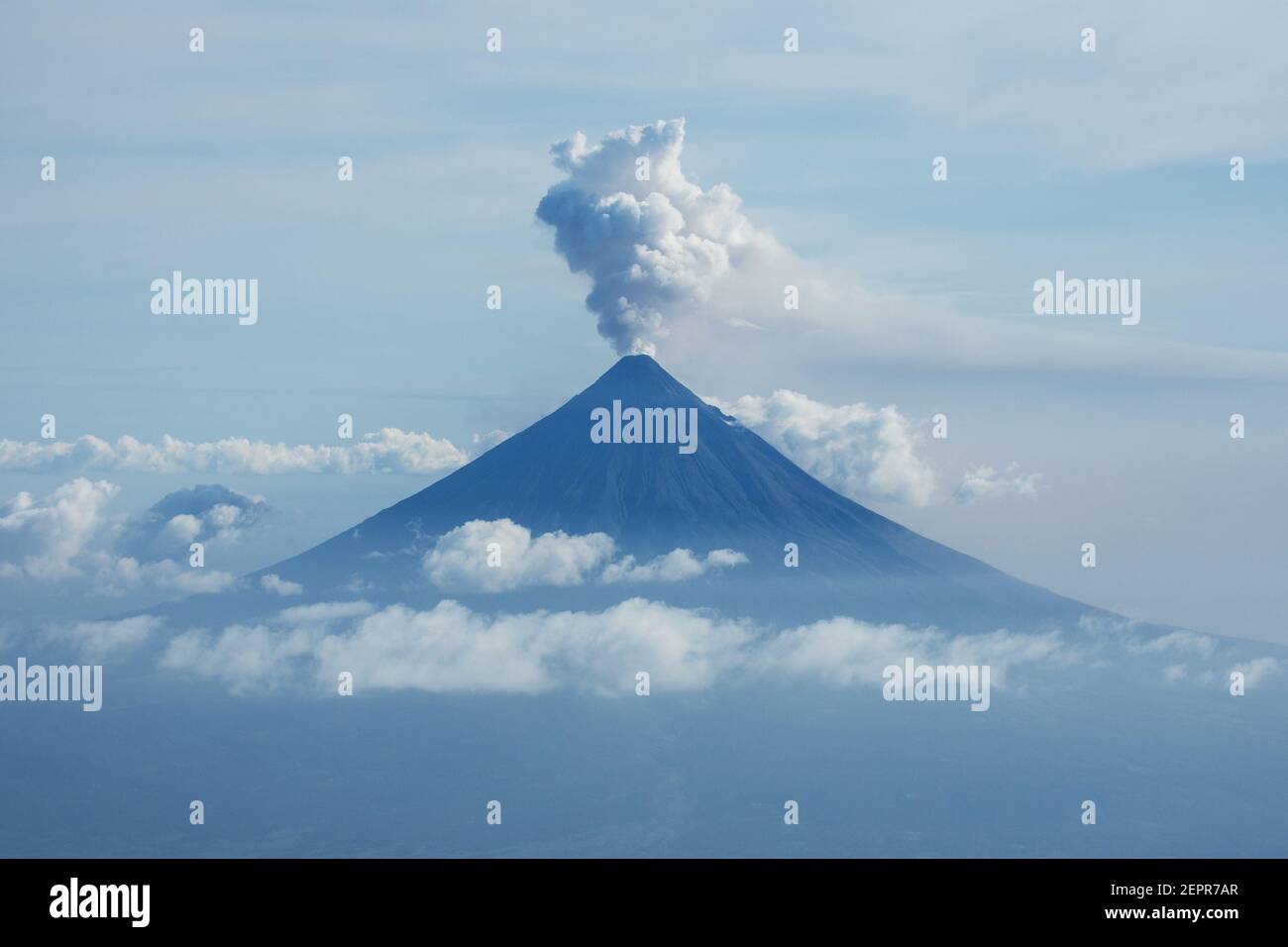 Mayon volcano spews ash as seen from Cebu Pacific Air aircraft above ...