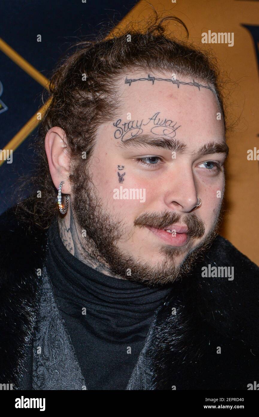 Post Malone walking on the red carpet at the The 2018 MAXIM Party held ...