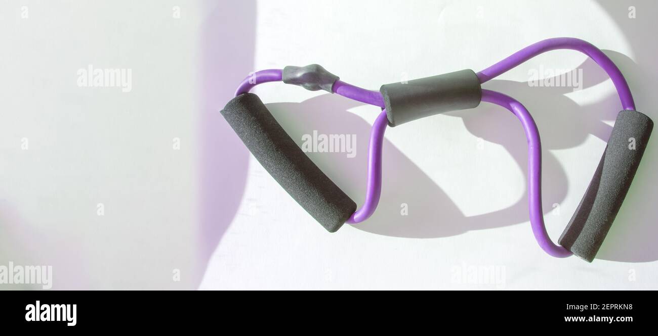 Back in action Modern rubber chest expander on white background banner ...