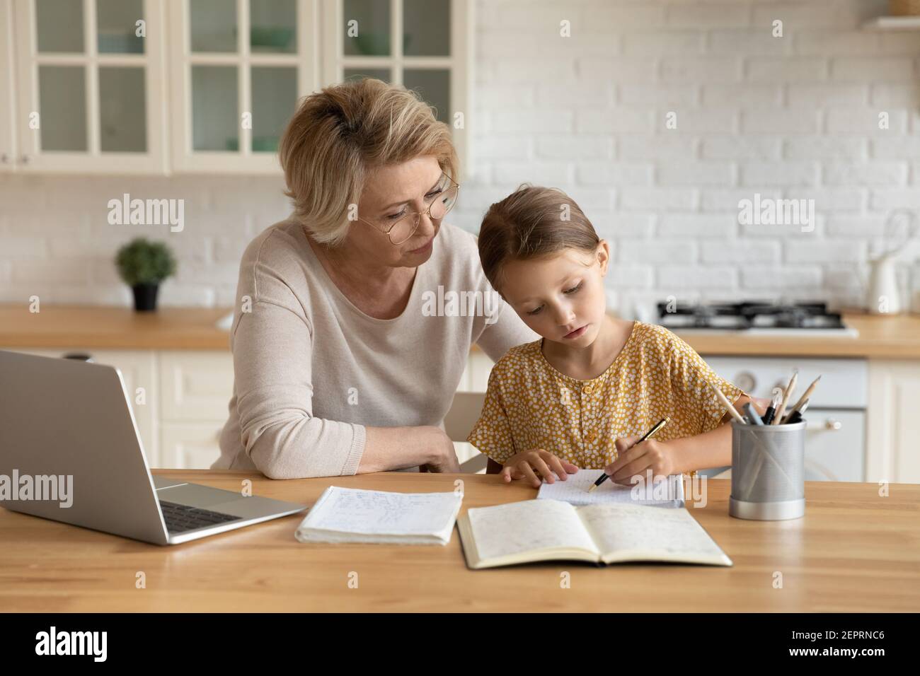 Senior teaching child school hi-res stock photography and images - Alamy