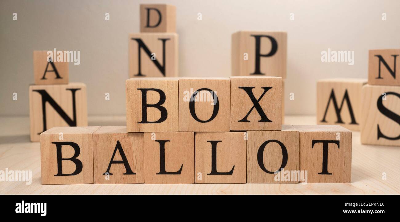 The word ballot box is from wooden cubes. Background from wooden ...