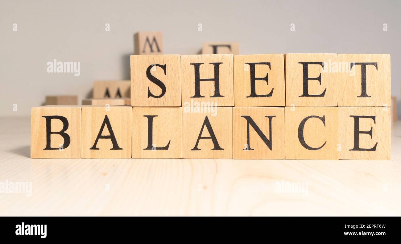 The word balance sheet is from wooden cubes. Background from wooden ...