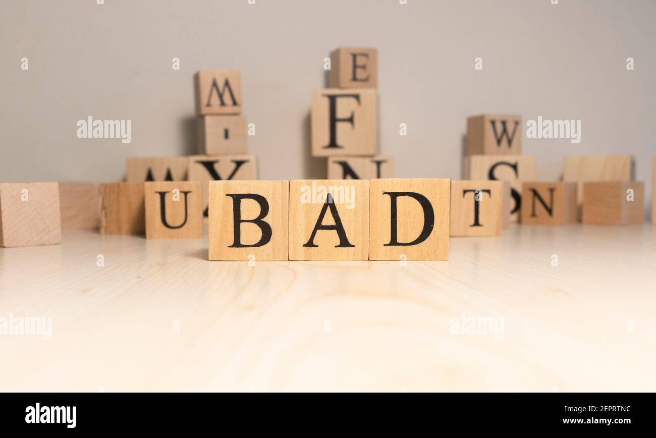 The word bad is from wooden cubes. Background from wooden letters ...