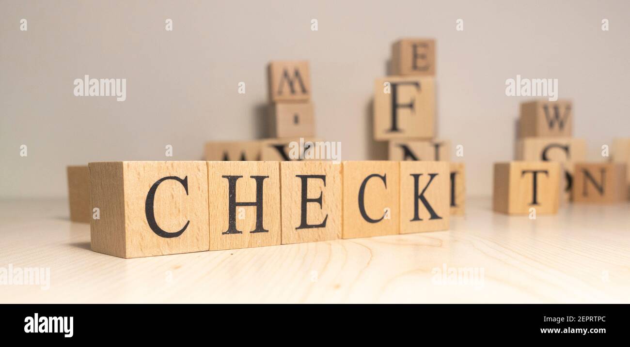 The word check is from wooden cubes. Background from wooden letters ...