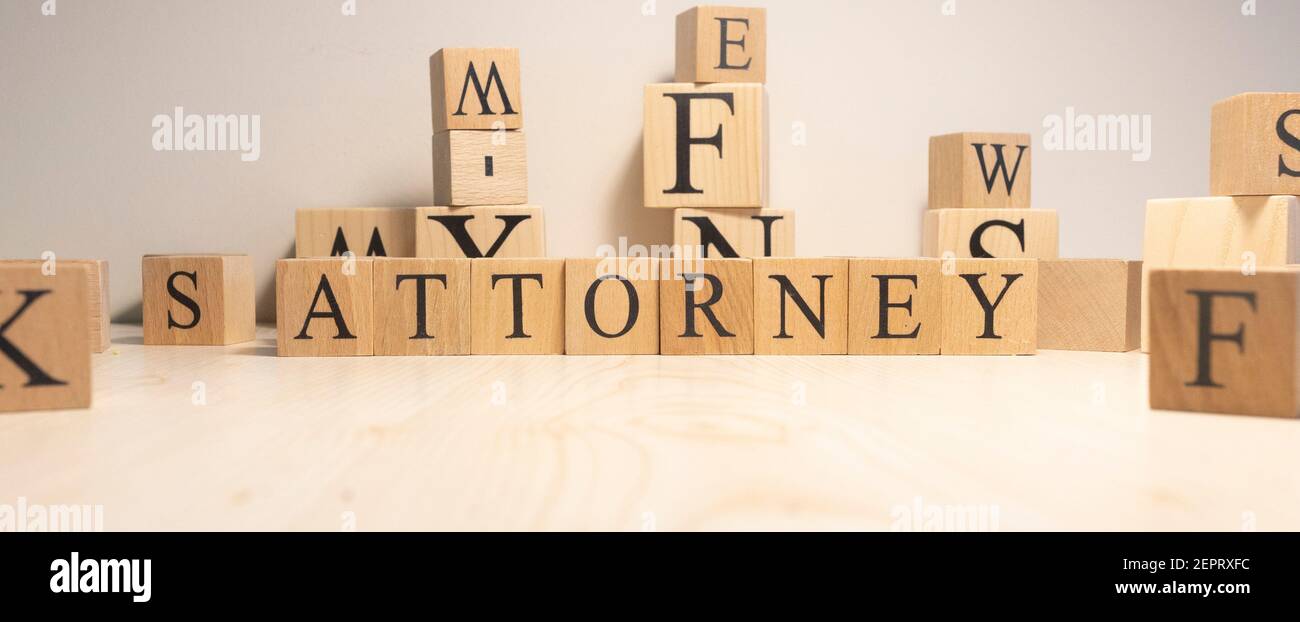 The word Attorney is from wooden cubes. Background from wooden letters ...