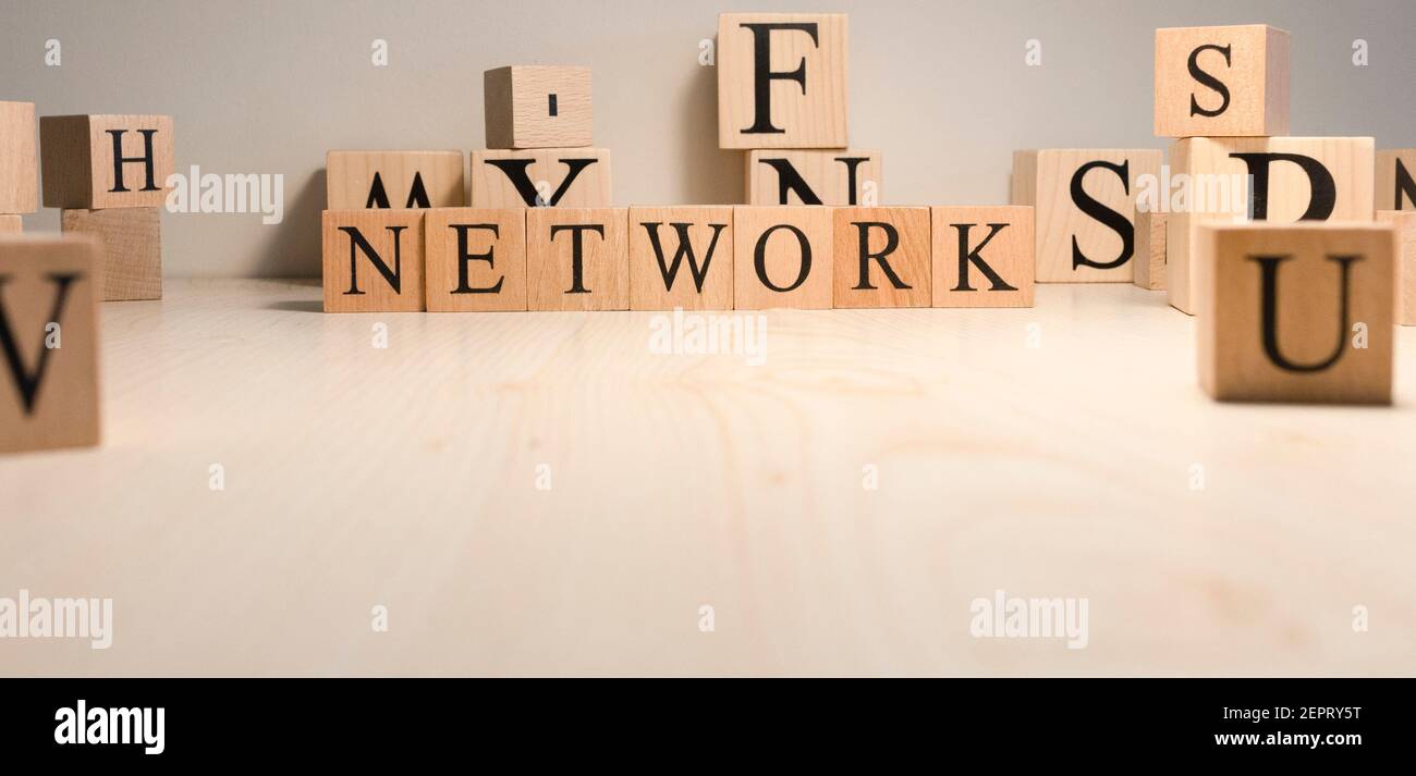 The word network is from wooden cubes. Background from wooden letters ...