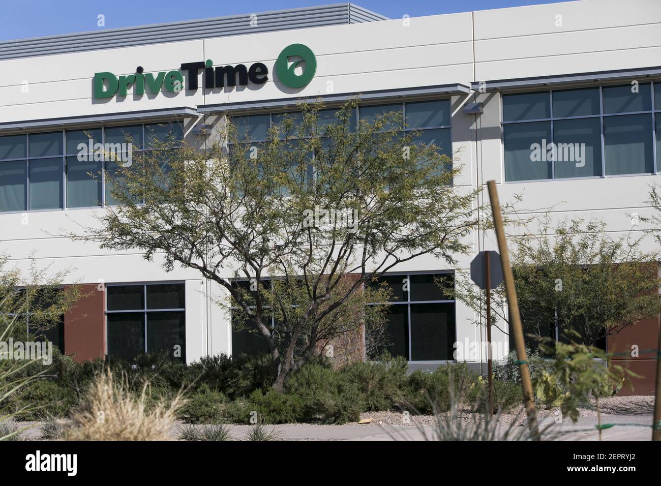 A logo sign outside of the headquarters of the DriveTime Automotive ...