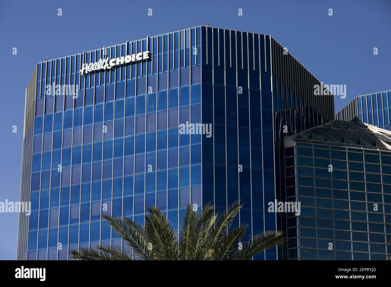 A logo sign outside of a facility occupied by Health Choice in Phoenix ...